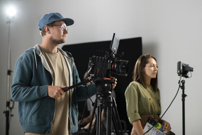 man-filming-with-professional-camera-new-movie - South Florida Reporter